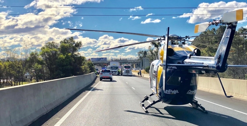 Helicopter lands on motorway after multi-vehicle crash - CareFlight