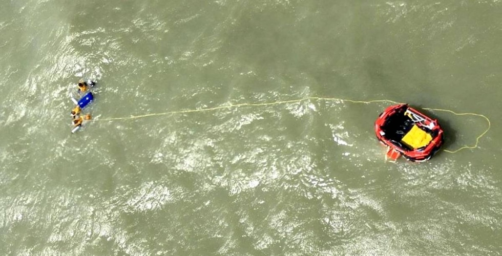 Three men rescued after boat sinks in rough seas - CareFlight